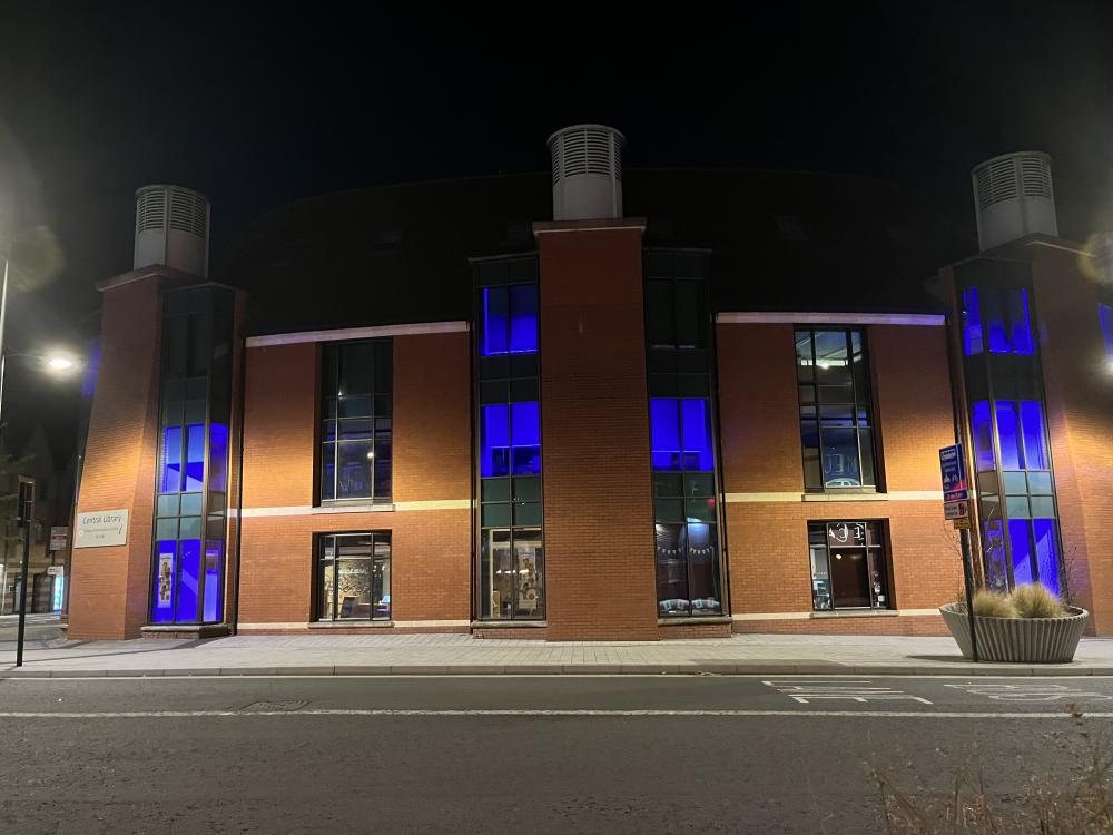 Library bathed in NHS blue for celebration